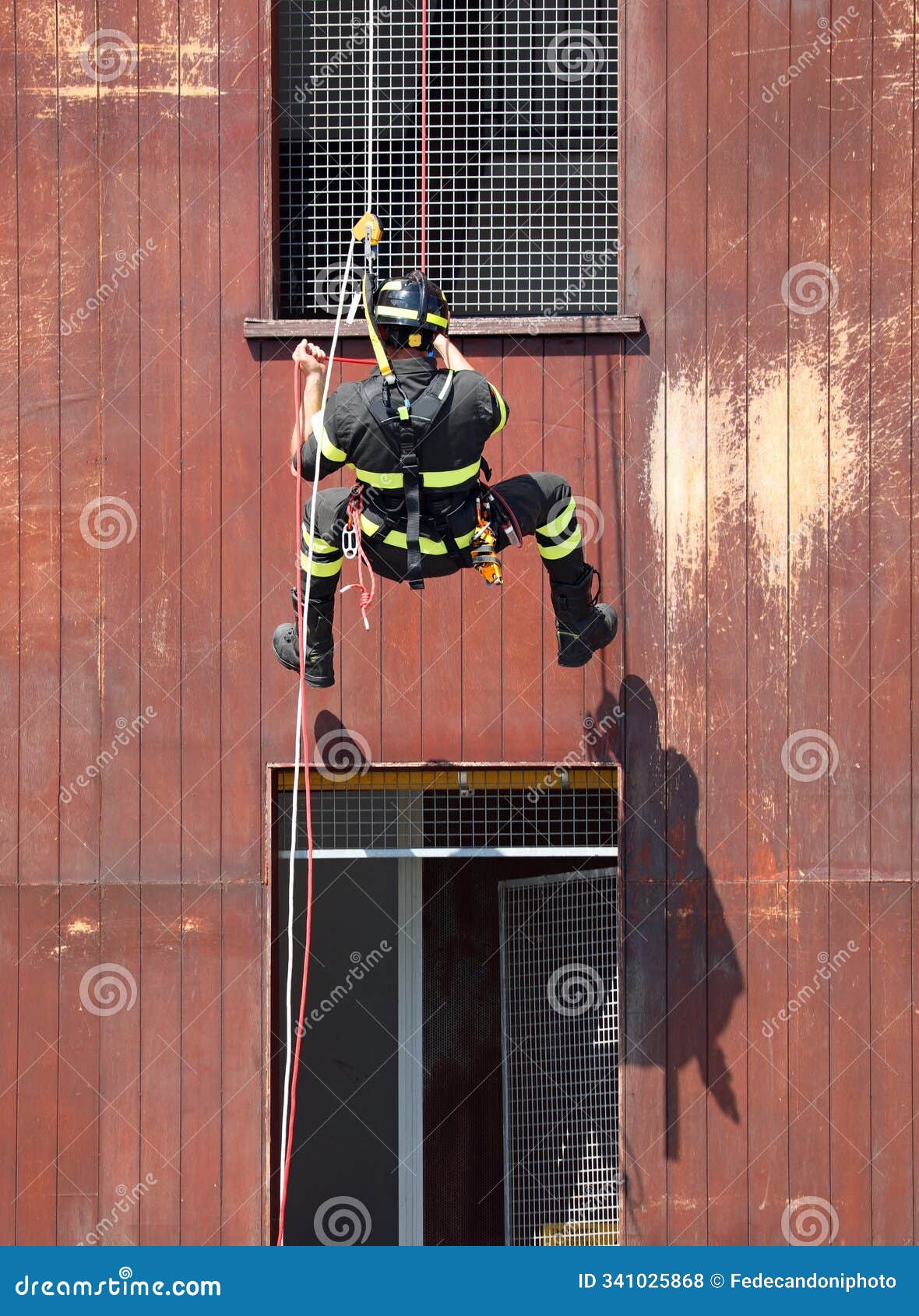 Firefighter Descending from a Building Using the Double Rope Technique ...