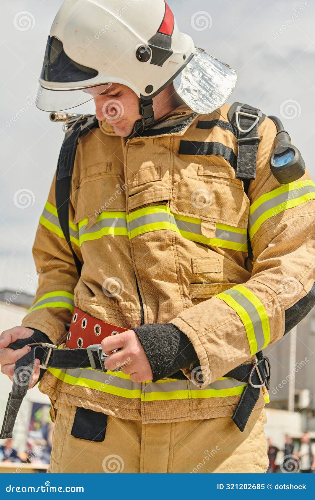 A Firefighter Dons the Essential Components of Their Professional Gear ...