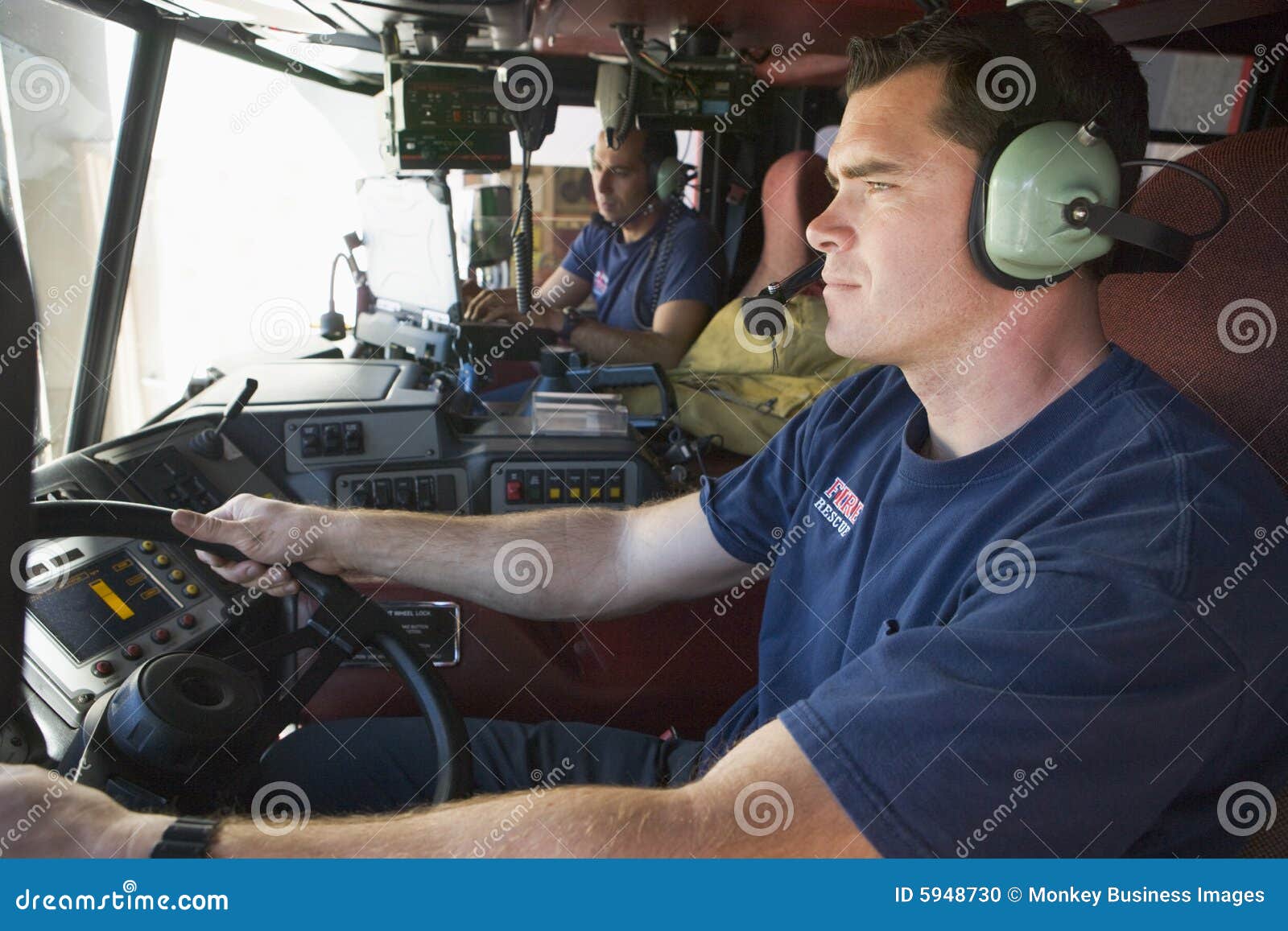 A Firefighter Driving a Fire Engine Stock Photo - Image of horizontal ...