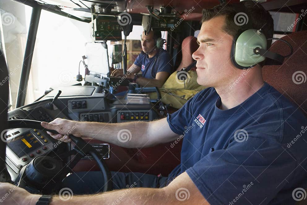 A Firefighter Driving a Fire Engine Stock Photo - Image of horizontal ...