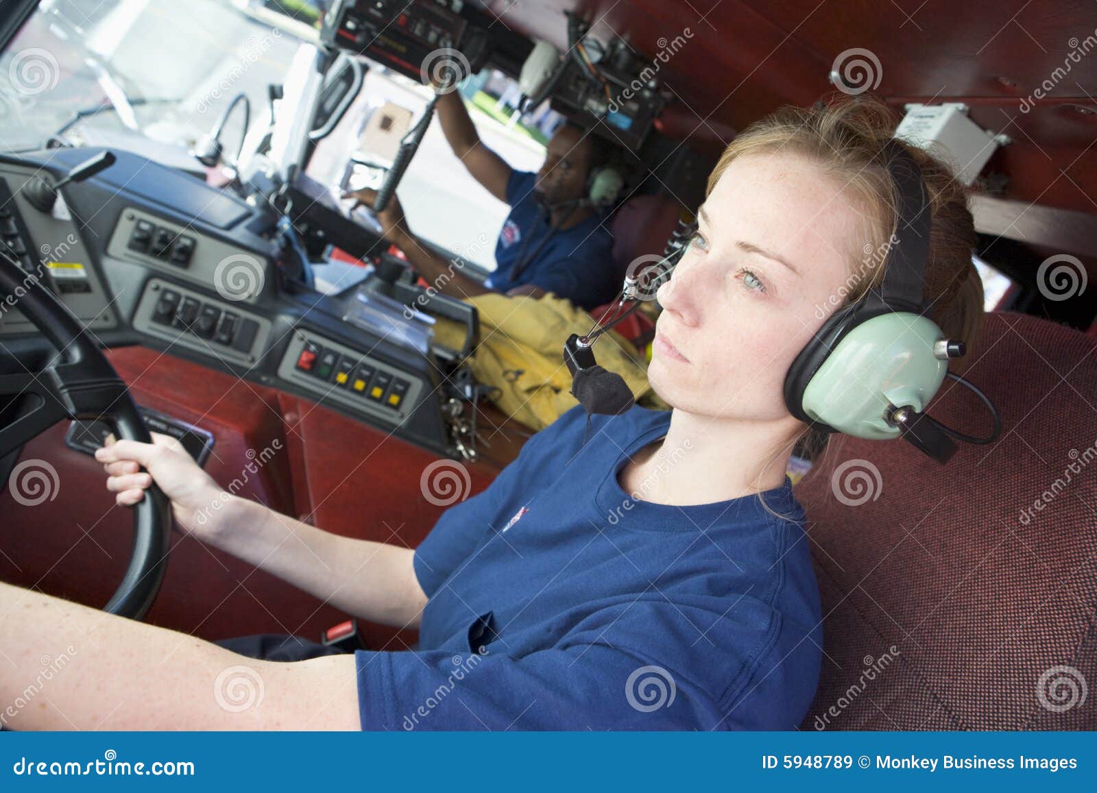 A Firefighter Driving a Fire Engine Stock Image - Image of indoors ...