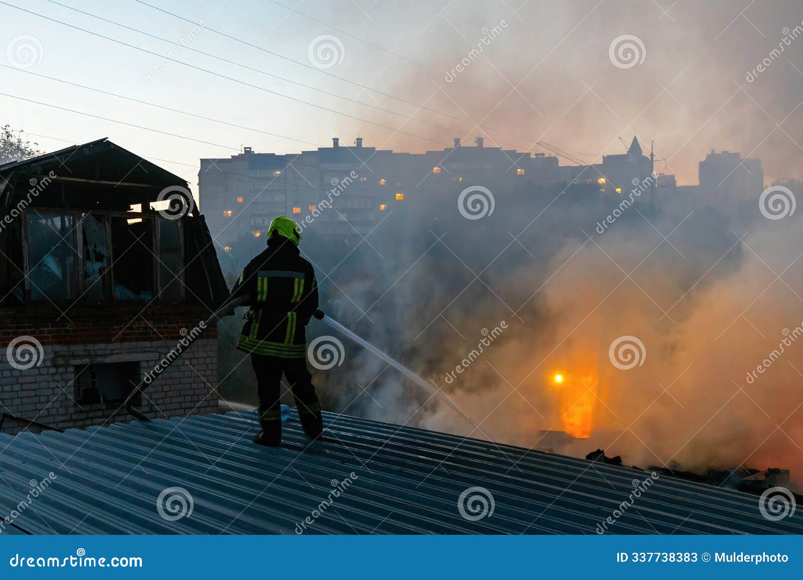 Firefighter Extinguish Fire in House Using Spraying Hose Stock Image ...