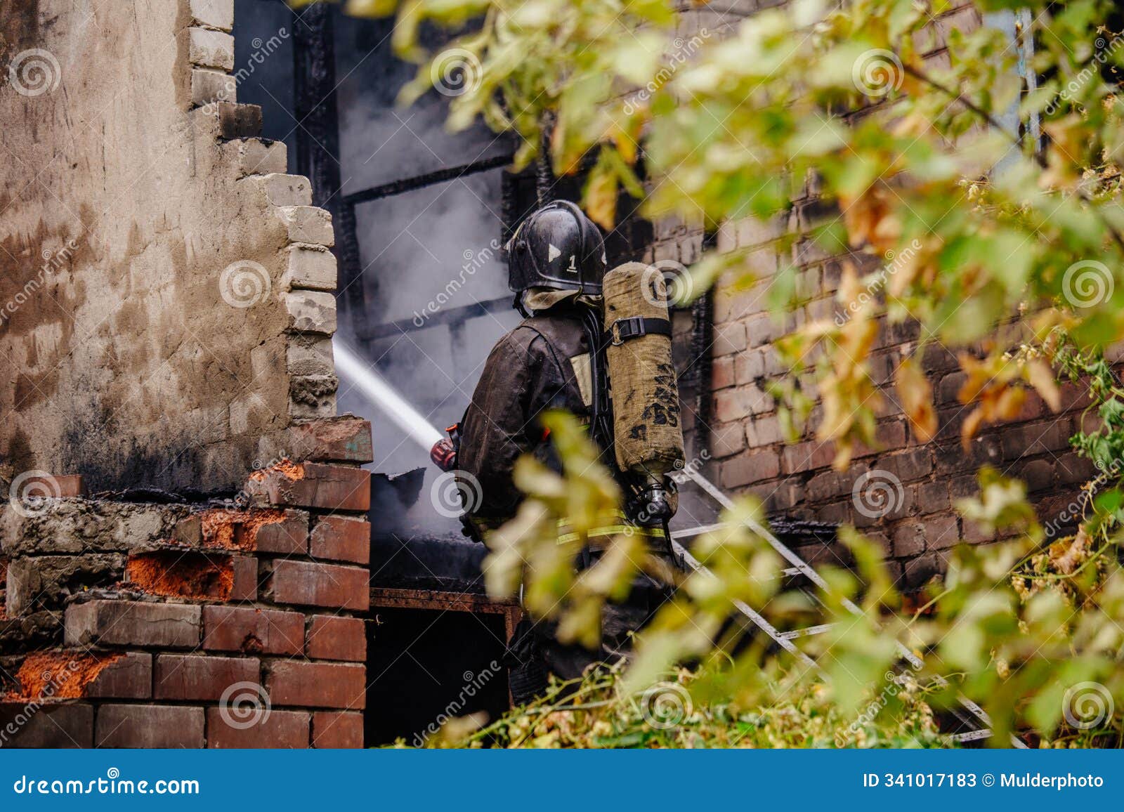 Firefighter Extinguish Fire in House Using Spraying Hose Stock Image ...