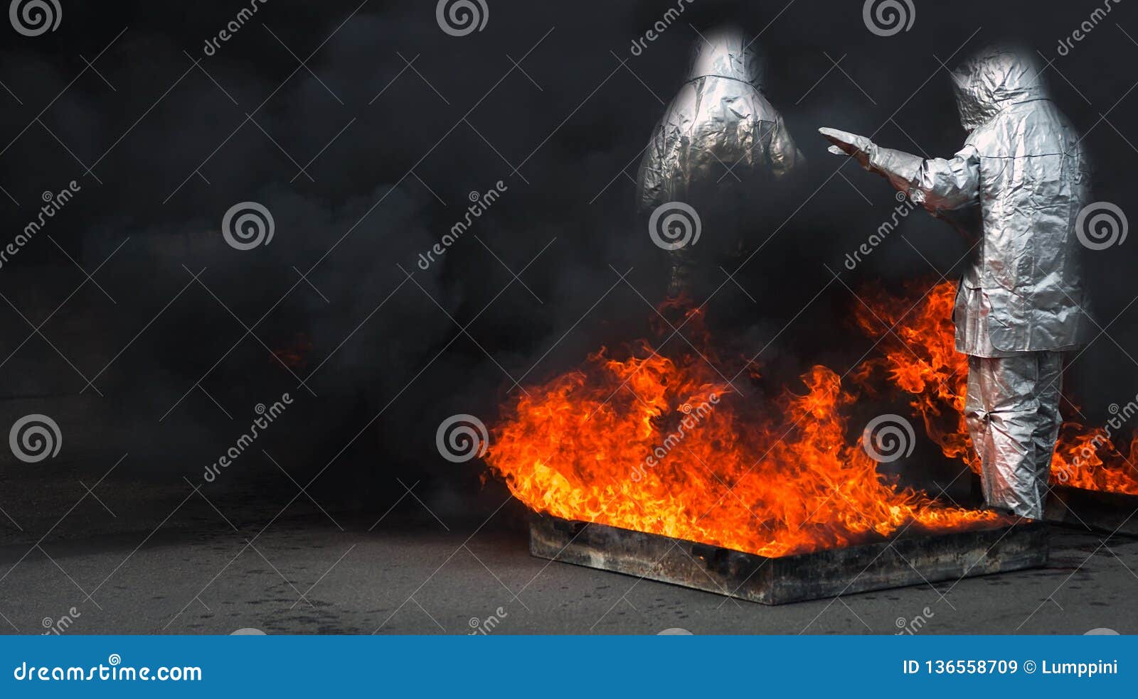 Firefighter Extinguishes the Fire with Smoke Stock Image - Image of ...