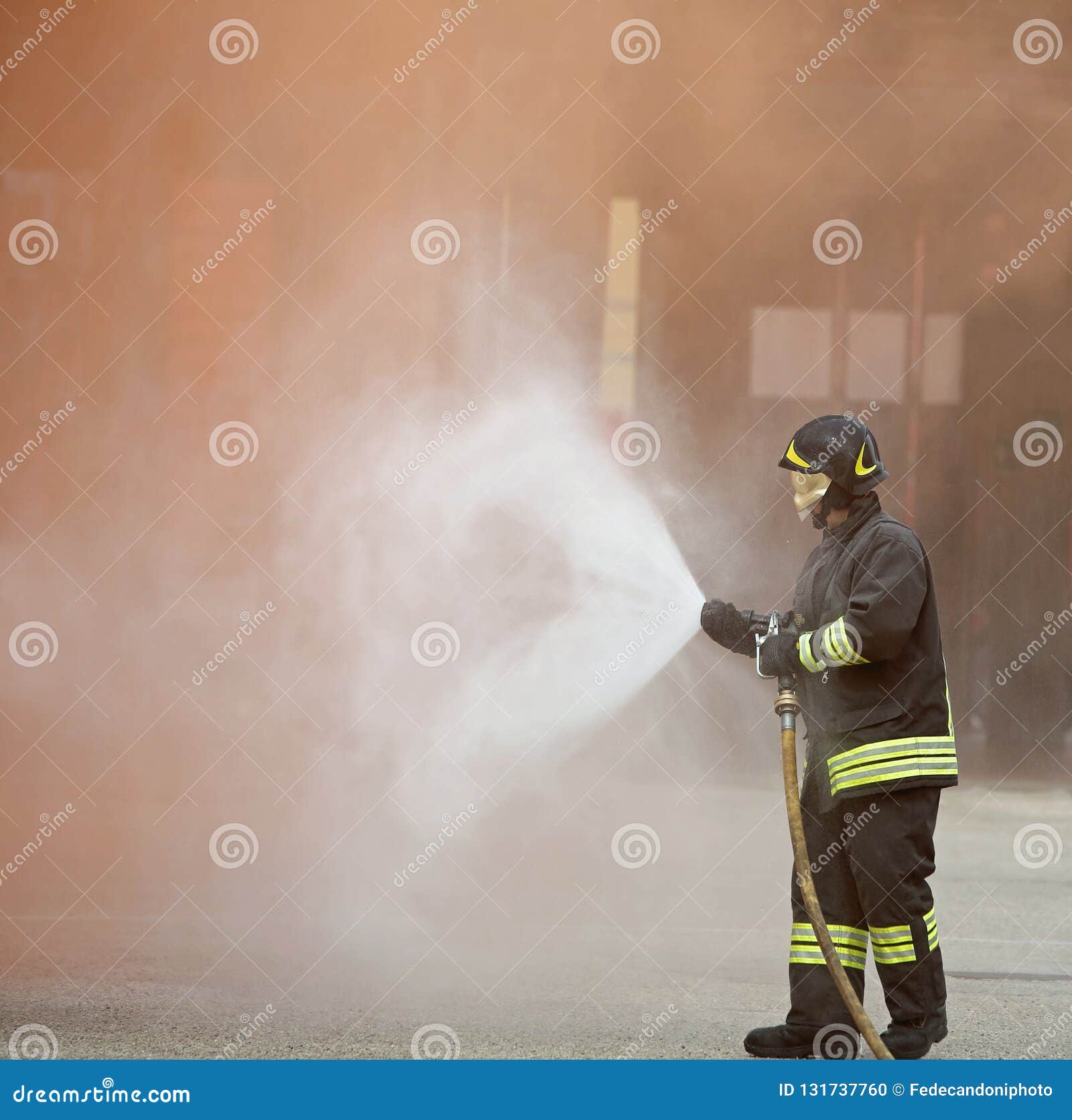 Firefighter Extinguishes a Large Fire Editorial Image - Image of ...