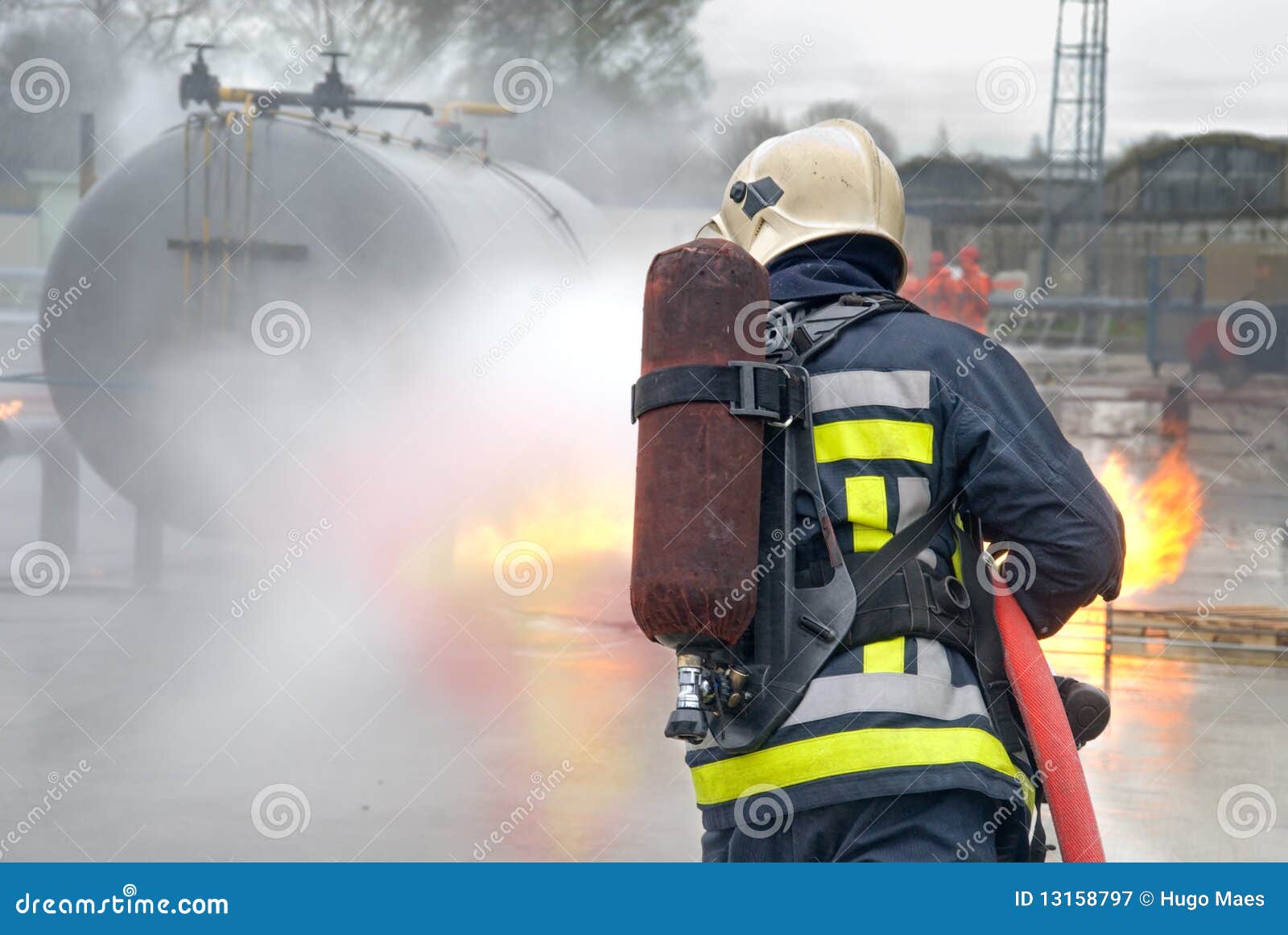 Firefighter Extinguishing Tank Fire Stock Image - Image of industrial ...