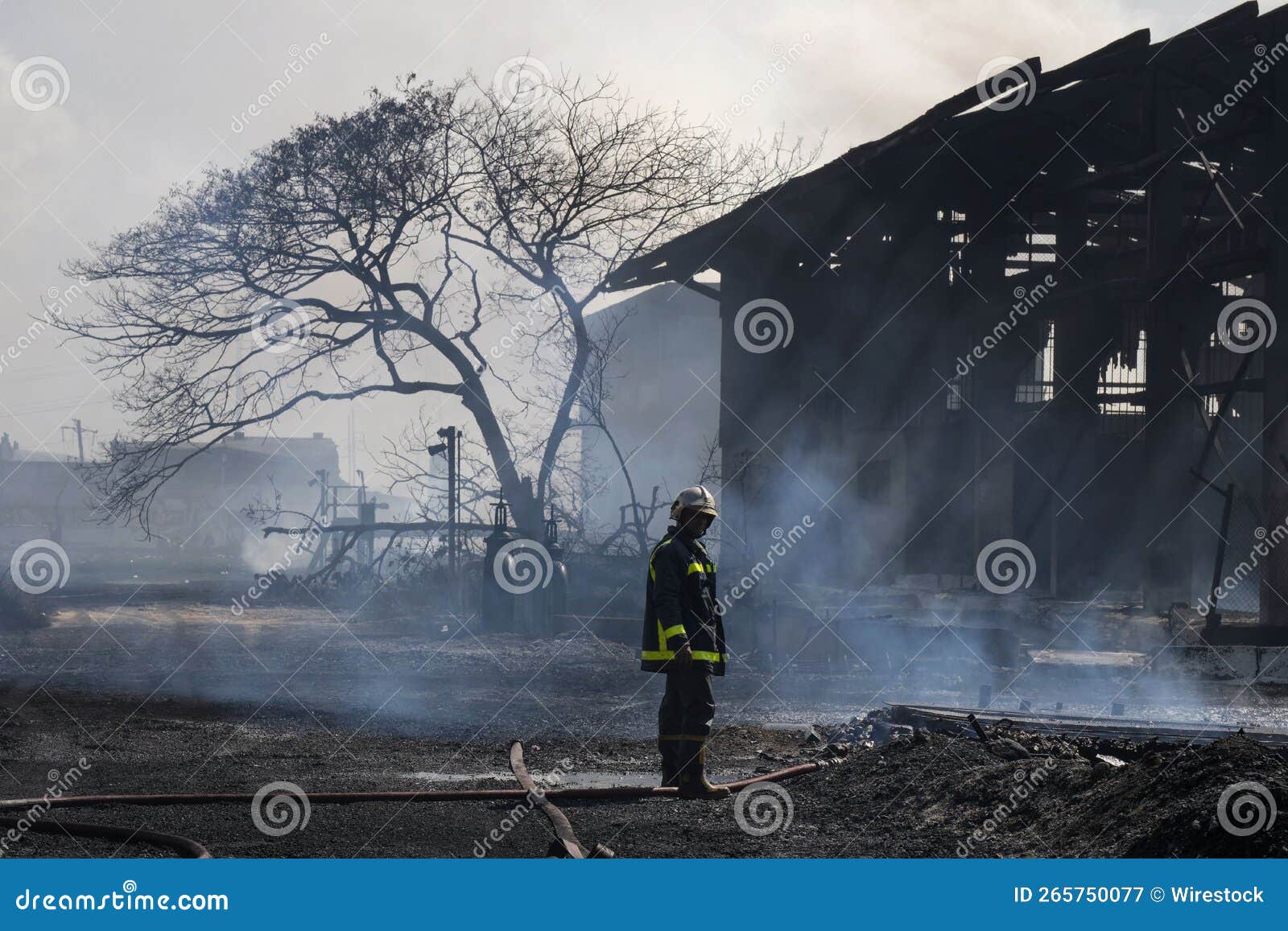 Firefighter Facing a Large-scale Fire at the Supertanker Base in ...