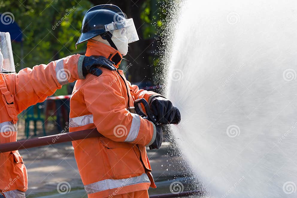 Firefighter Fighting for a Fire Attack Stock Photo - Image of fighting ...