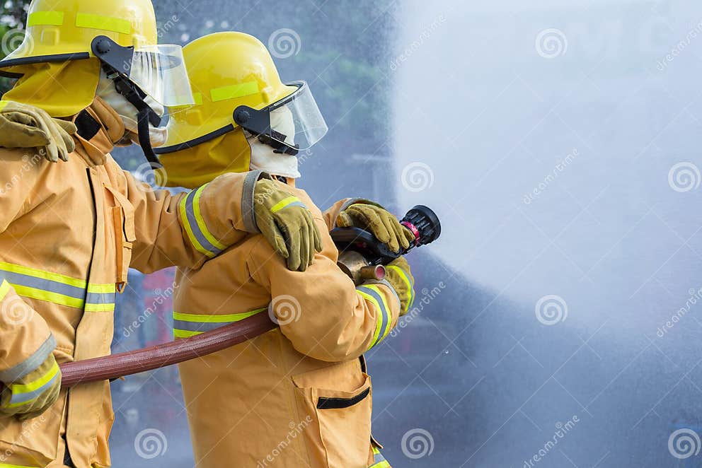 Firefighter Fighting for a Fire Attack Stock Image - Image of male ...