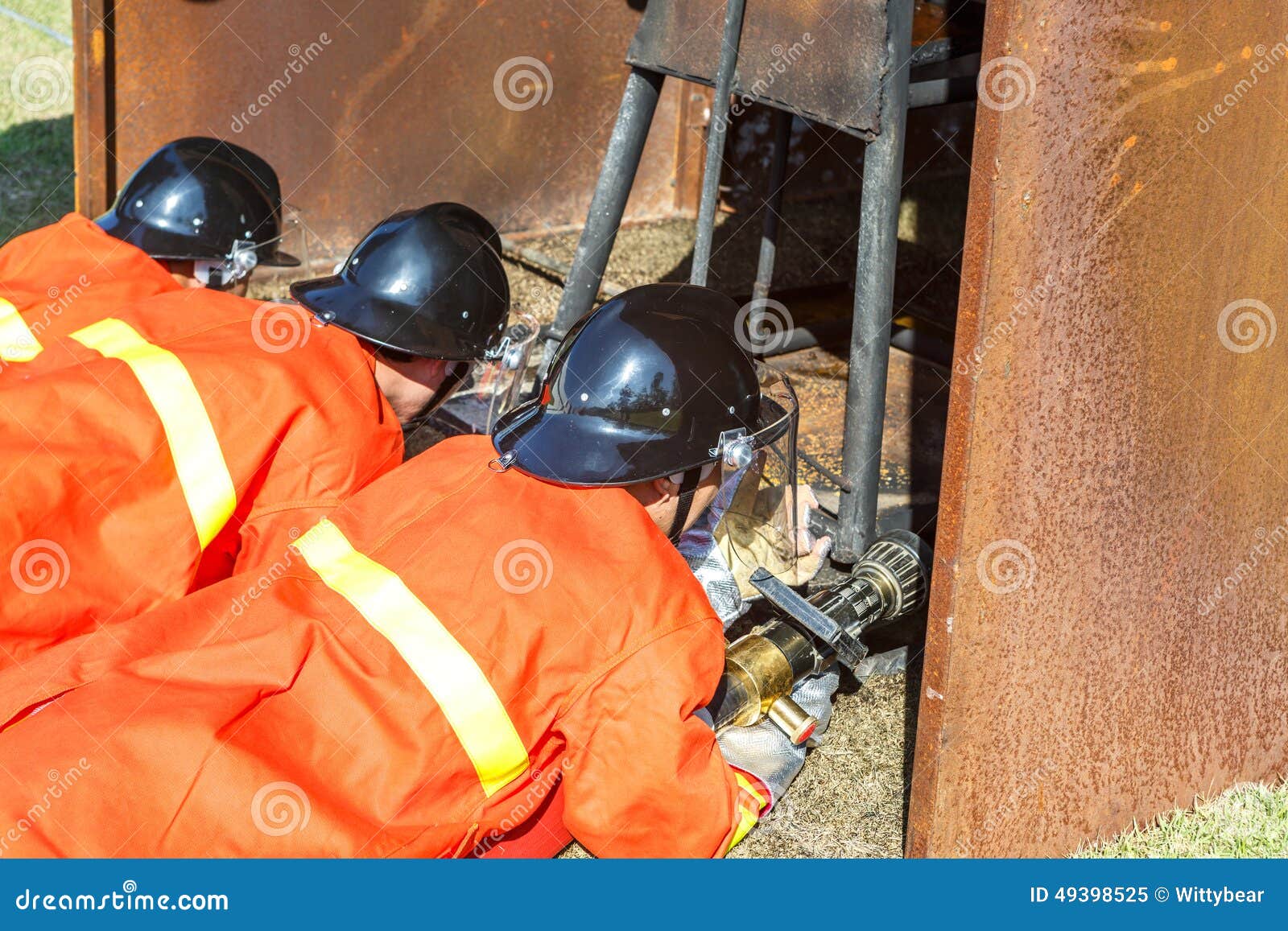 Firefighter Fighting With Flame Using Fire Hose Chemical Water Foam ...