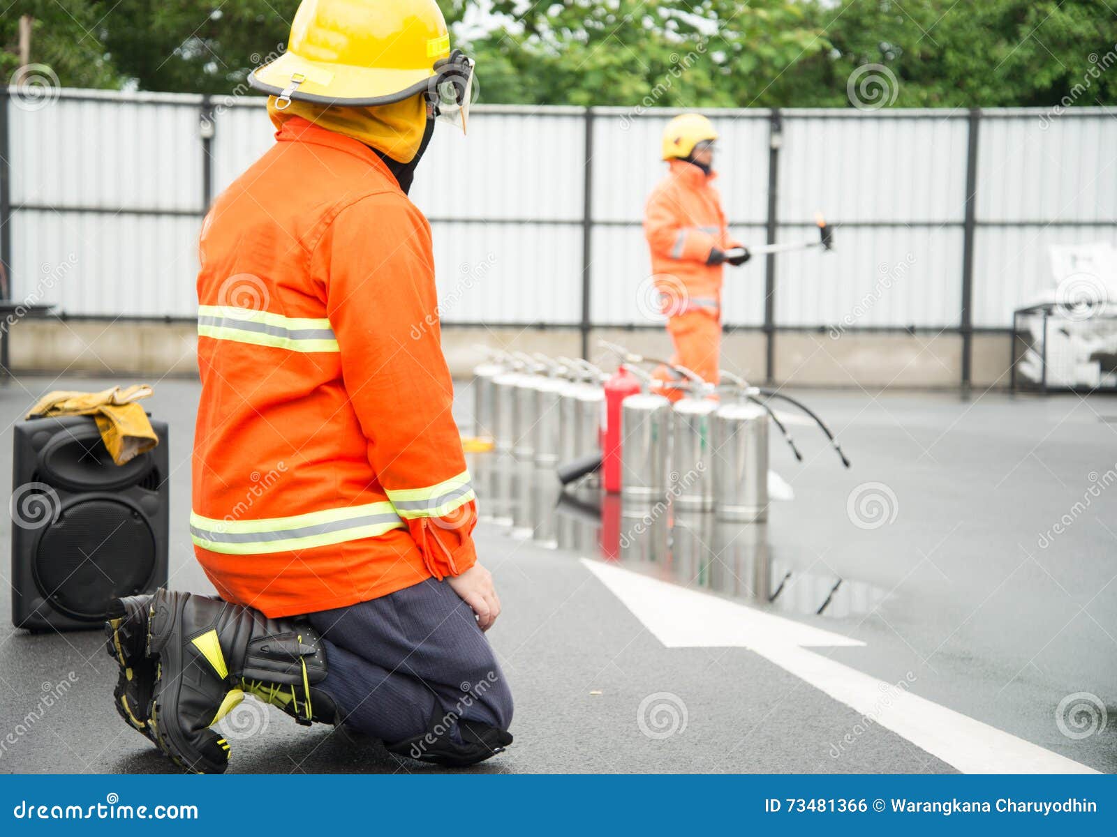 Firefighter Fighting With Flame Using Fire Hose Chemical Water Foam ...
