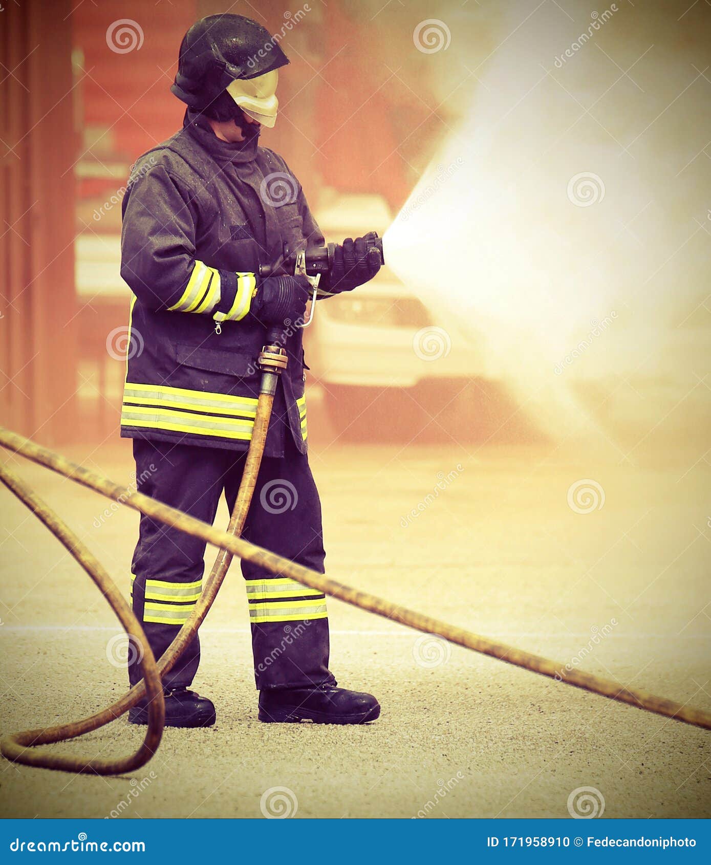 Firefighter during Fire Extinguishing and Old Toned Effect Stock Photo ...