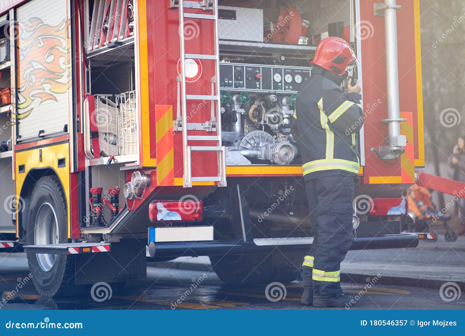Firefighter in Fire Fighting Operation. Firefighter in Protective ...