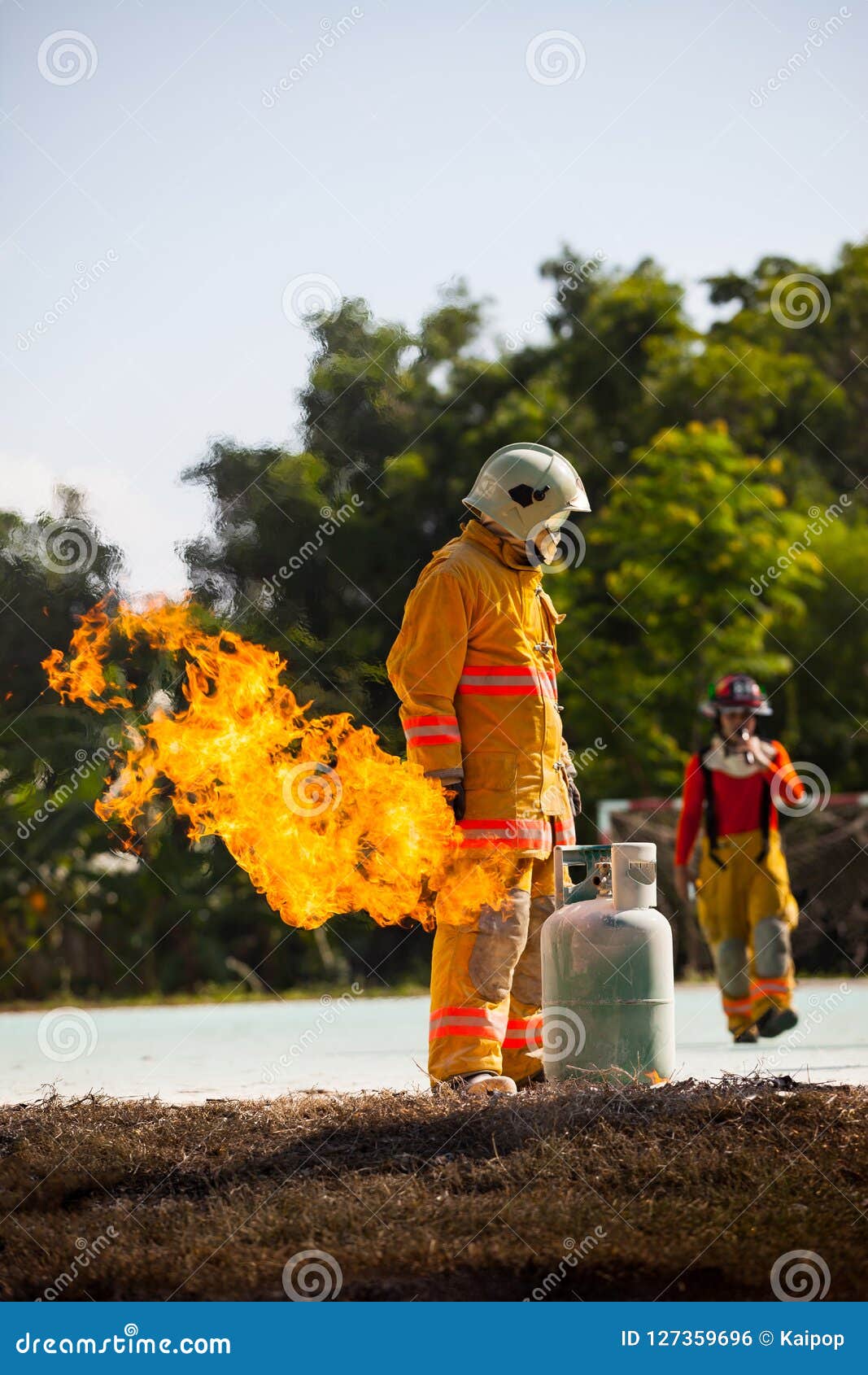 Firefighter with Fire and Suit for Protect. Stock Photo - Image of ...