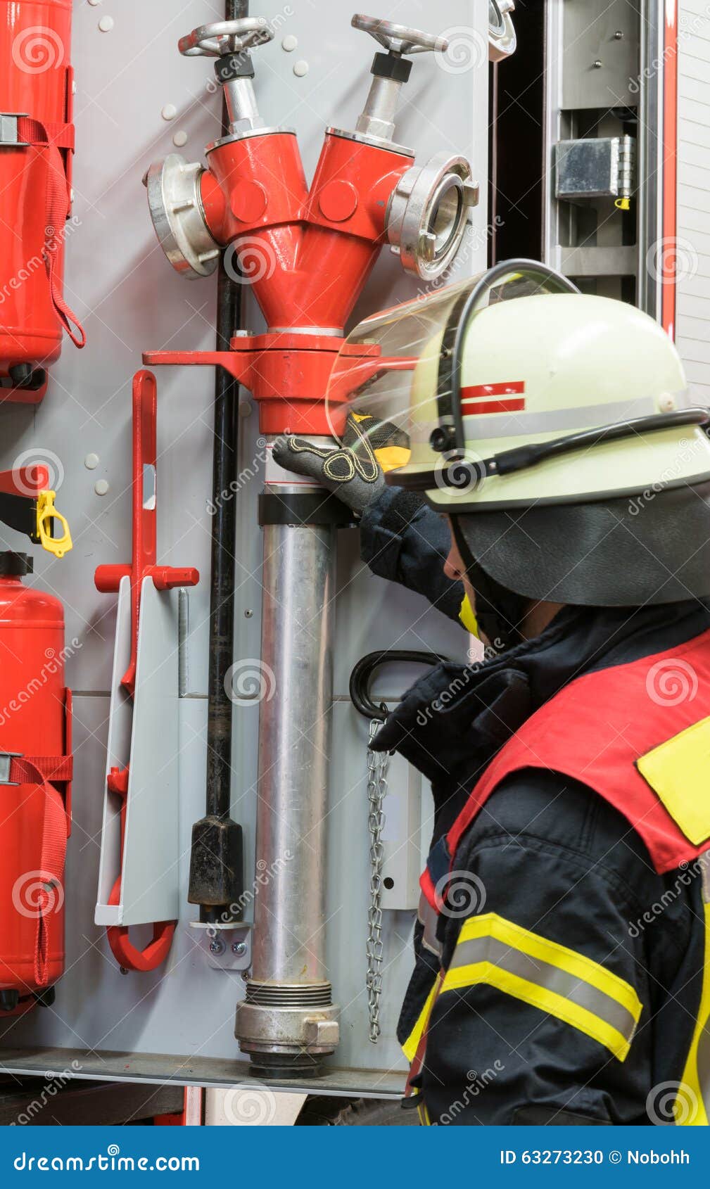 Firefighter on the Fire Truck with Water Pipe Stock Photo - Image of ...