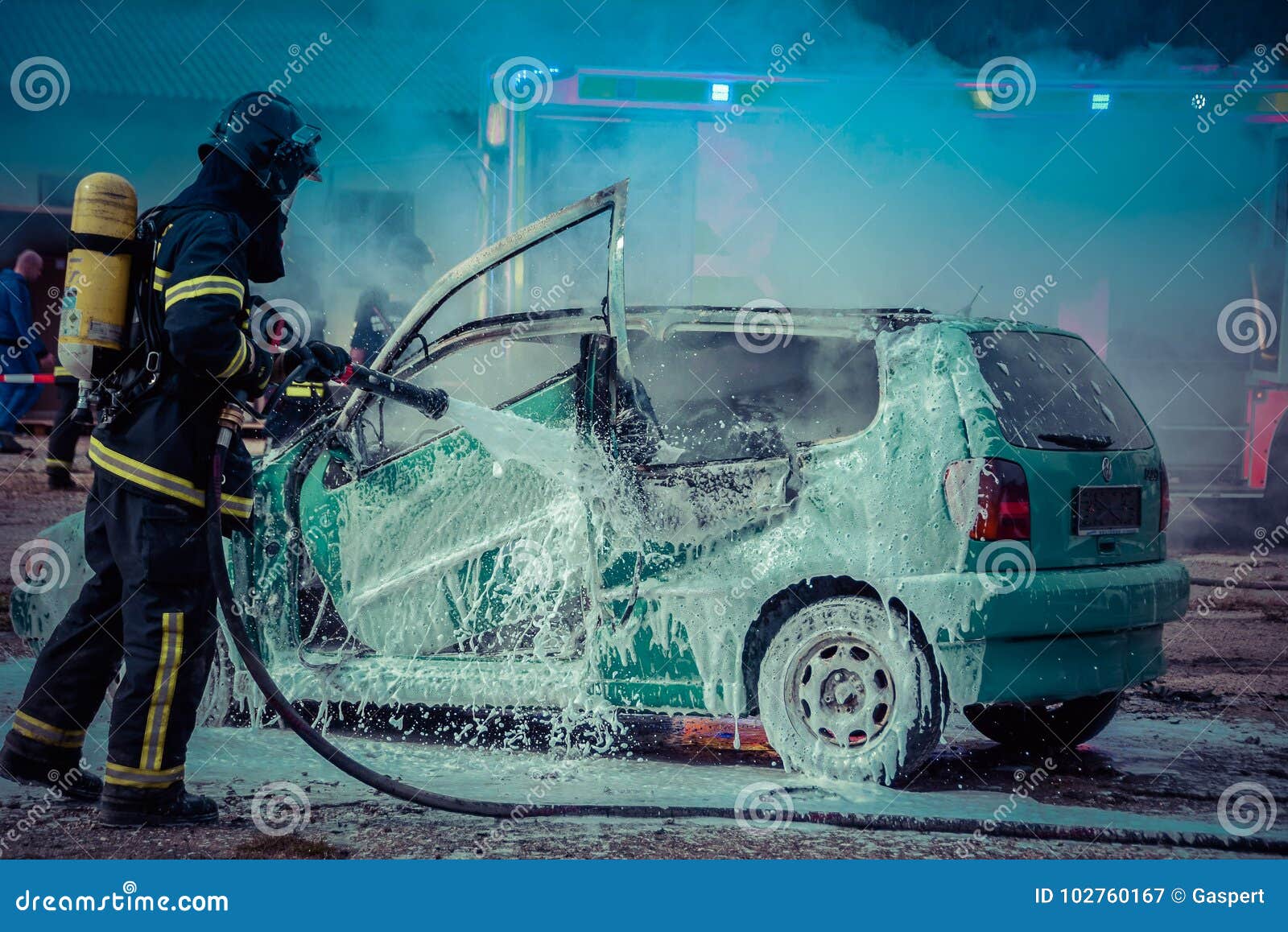 Firefighter - Firemen Extinguishing a Car with Foam Editorial ...