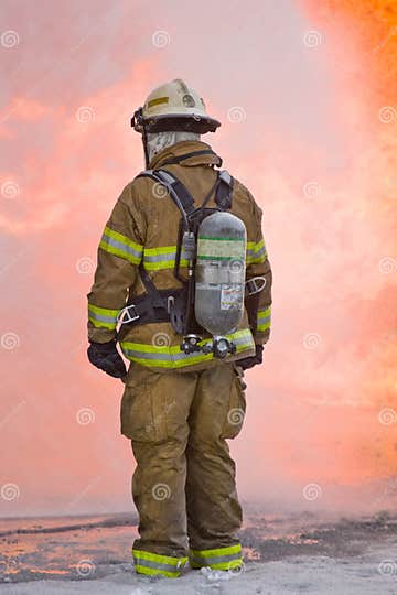 Firefighter with Flames stock photo. Image of blazing - 18277884