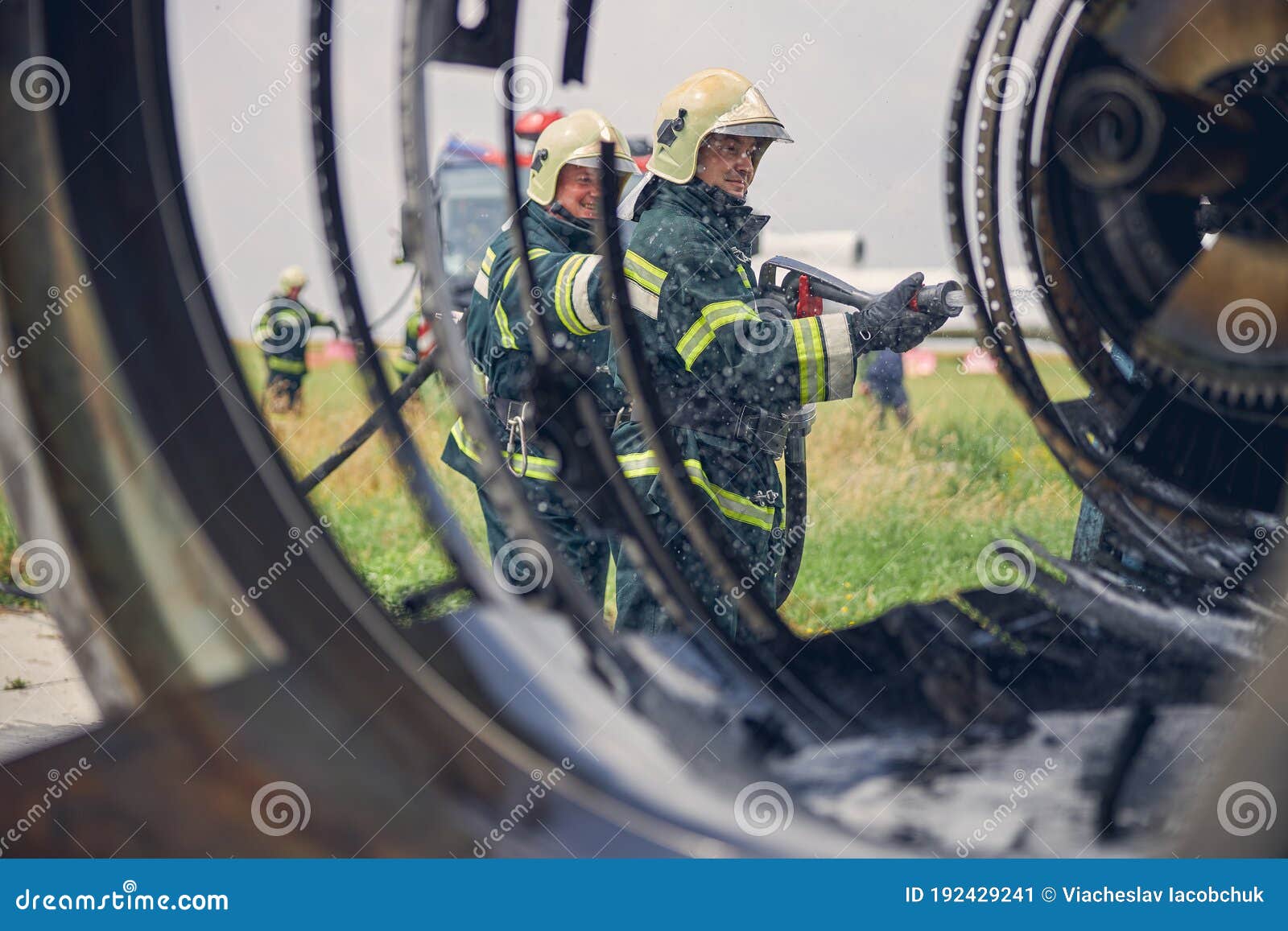 Firefighter in Green Fireproof Uniform at the Emergency Operation Stock ...