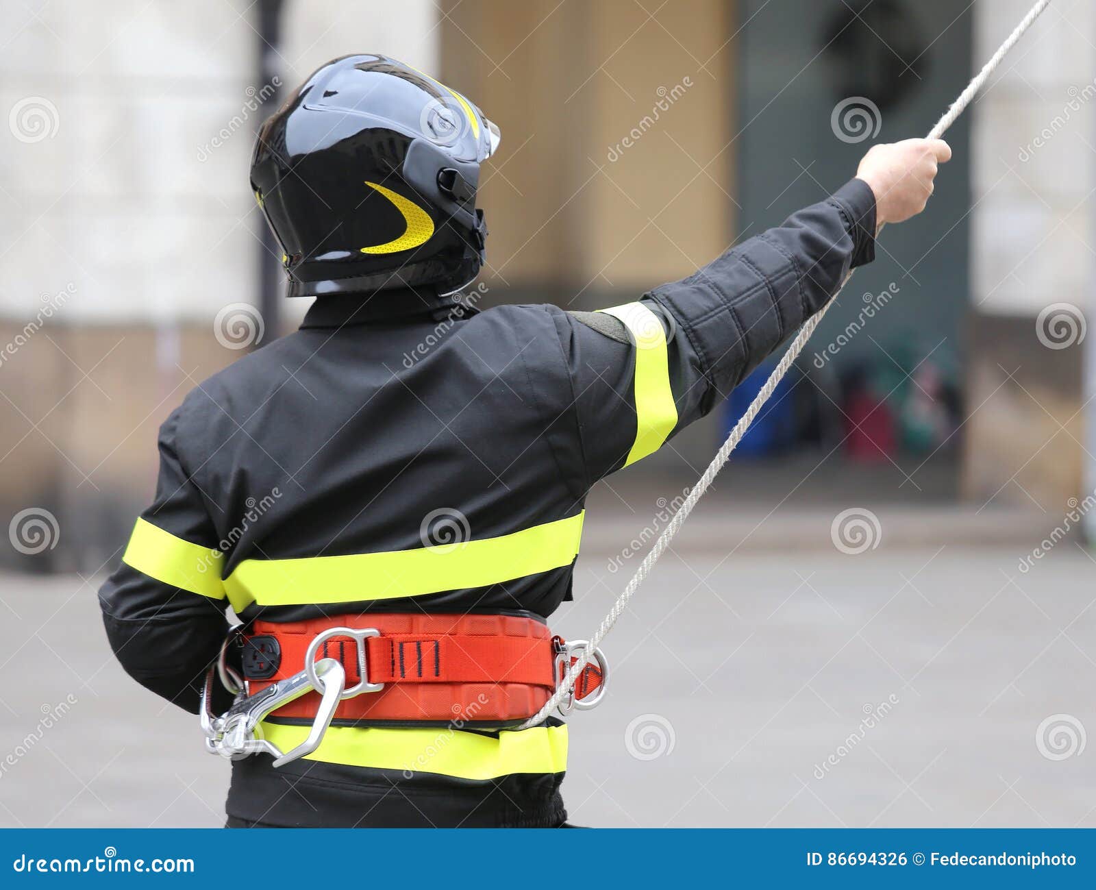 Firefighter with Hardhat during Rescue Operations with a Rope Editorial ...