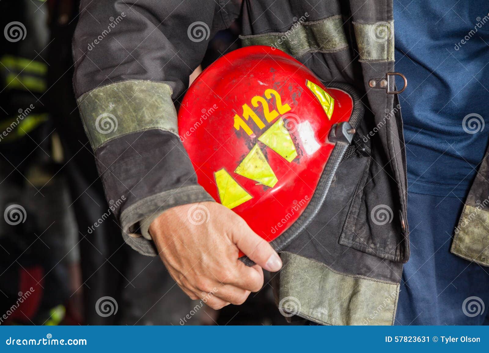 Firefighter Holding Red Helmet at Fire Station Stock Image - Image of ...