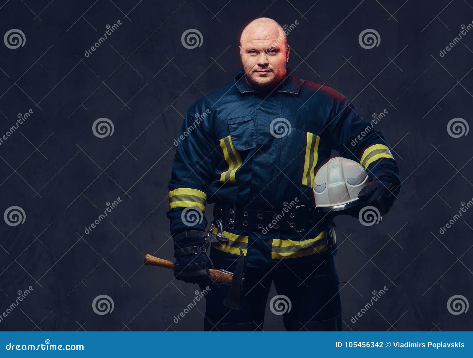 Firefighter holds the axe. stock photo. Image of background - 105456342