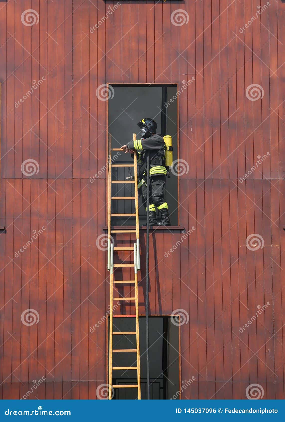 Firefighter With A Ladder And The Oxygen Cylinder Stock Photography ...