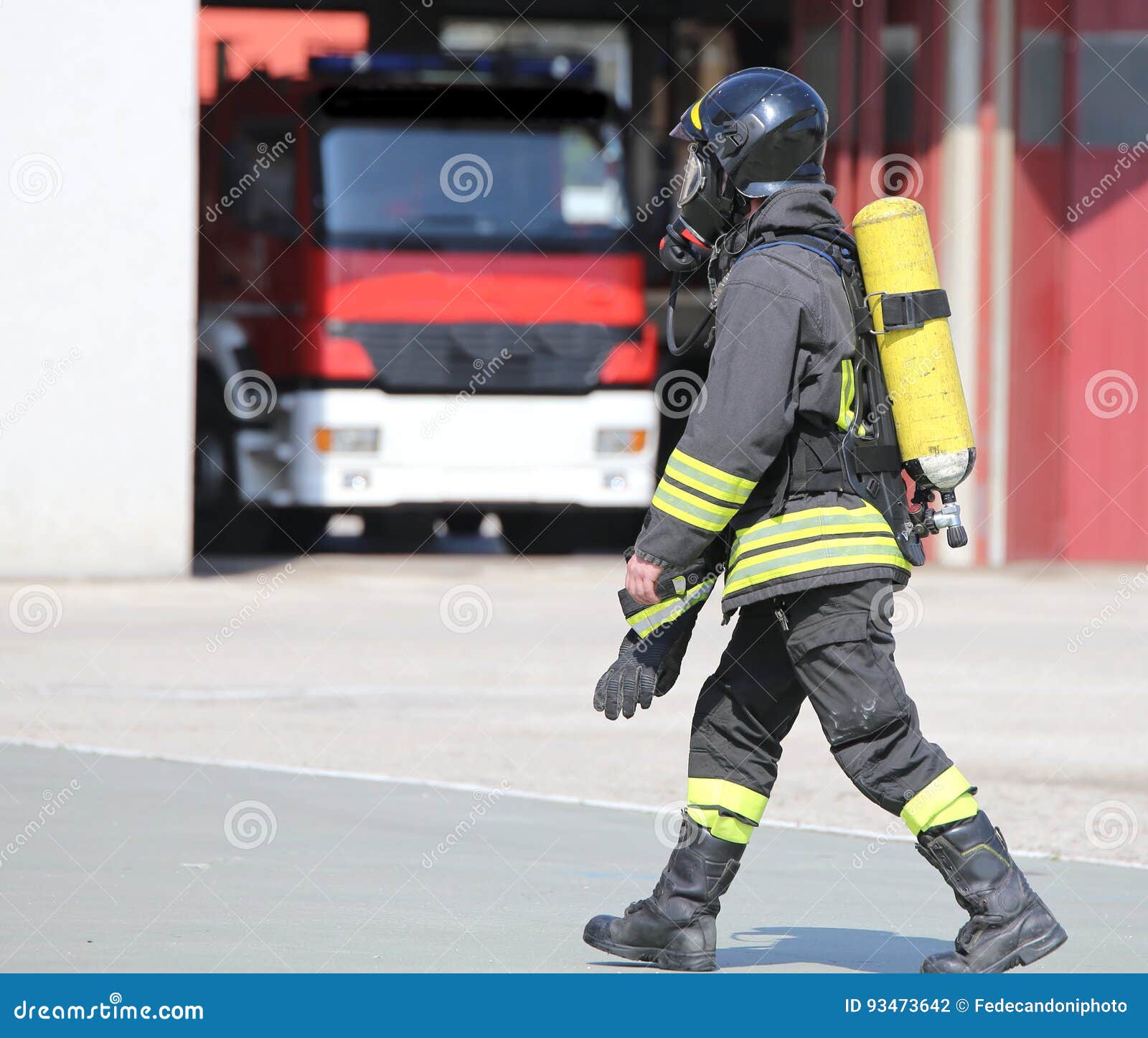 Firefighter with Large Oxygen Cylinder and Automatic Respirator Stock ...