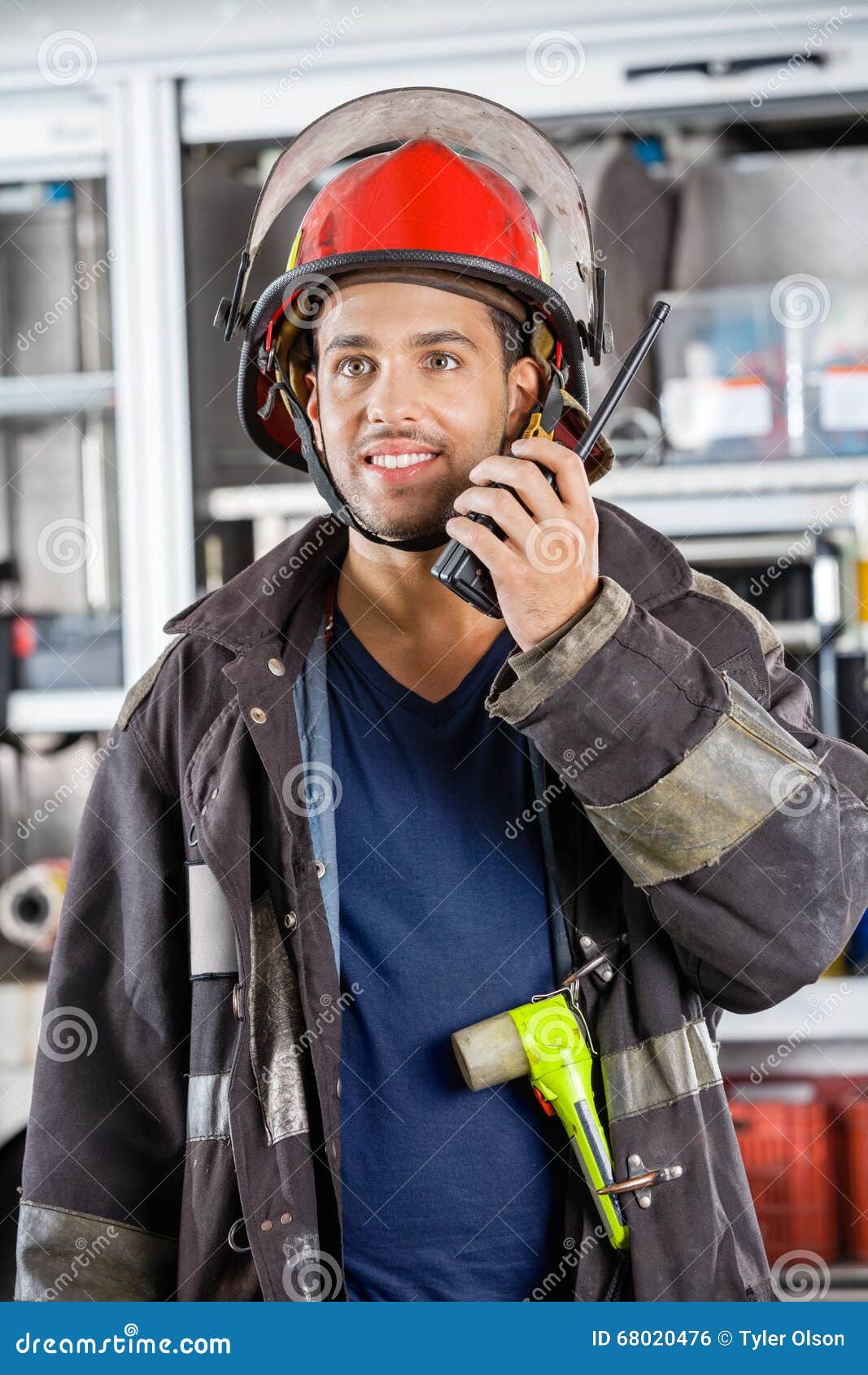 Firefighter Looking Away while Using Walkie Talkie Stock Photo - Image ...