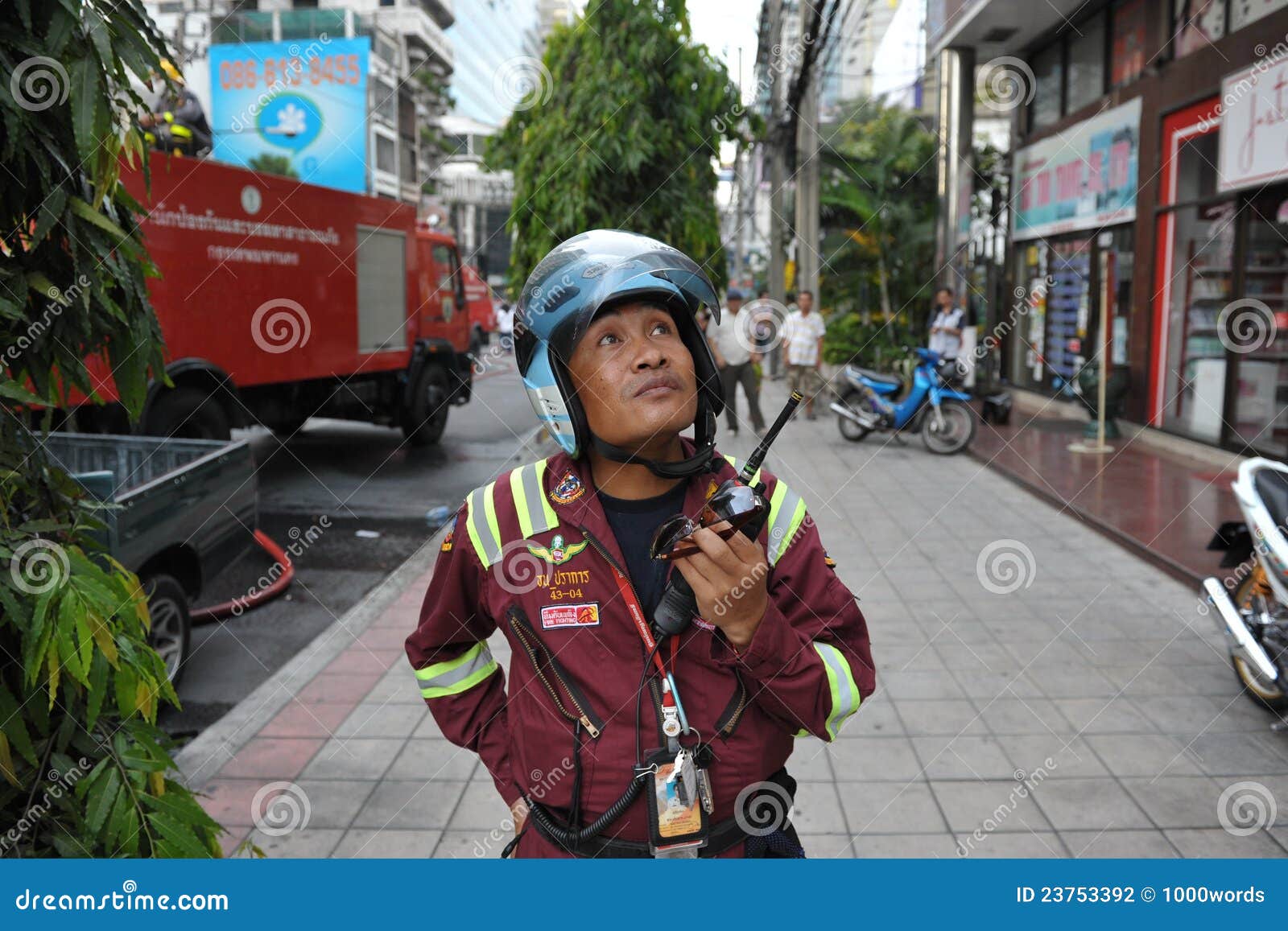 A Firefighter Looks on at Blaze in an Office Block Editorial ...