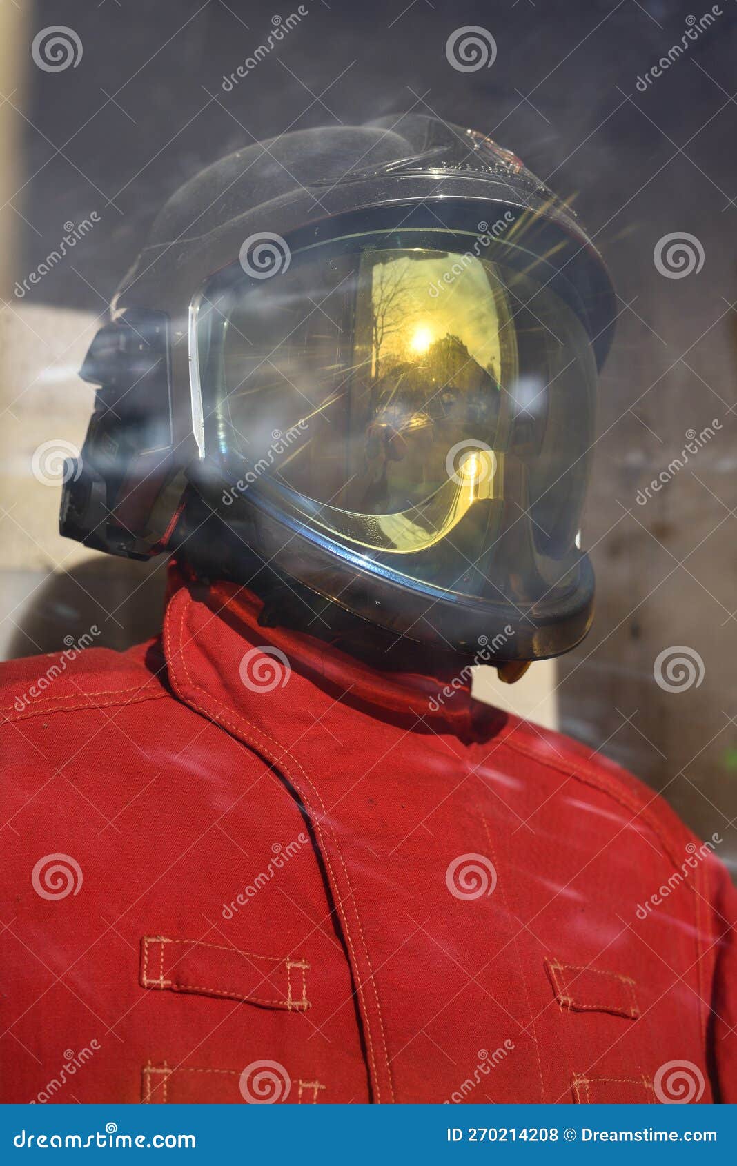 Firefighter Mannequin with Uniform and Golden Visor Helmet Stock Photo ...