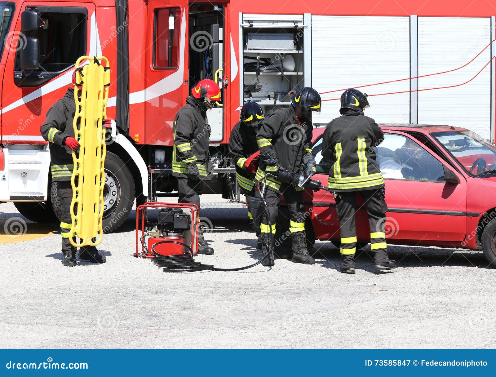 Firefighter Open Car Door with Pneumatic Shears after the Traffic ...