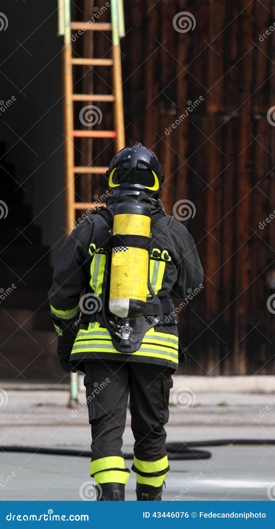 Brave Firefighter Using Extinguisher And Water From Hose For Fire ...