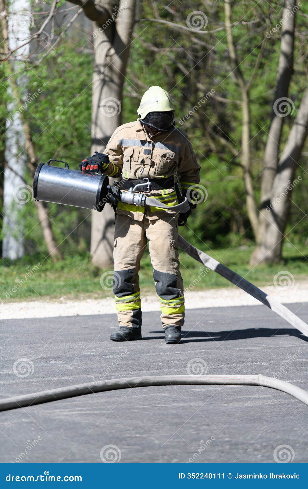 Firefighter with Fire Suppression Device in Hand Editorial Photo ...