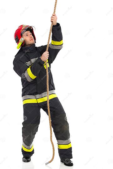 Firefighter pulling a rope stock photo. Image of full - 38318704