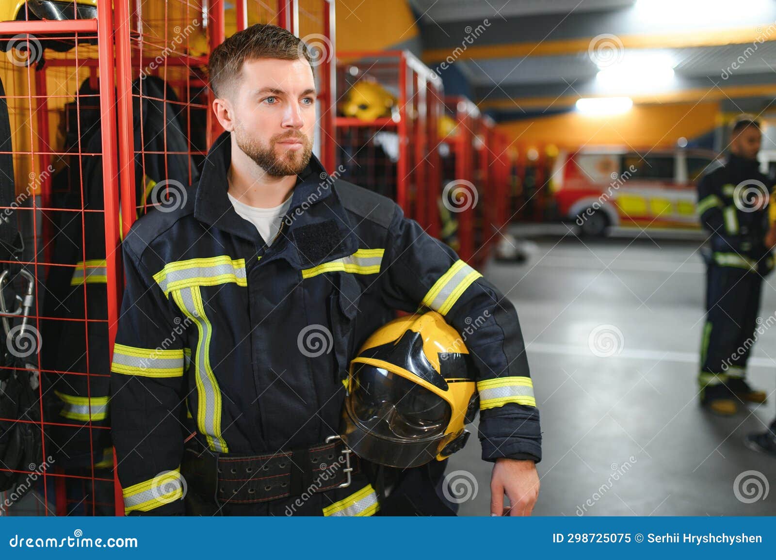A Firefighter Puts on a Fire Uniform at the Fire Department Stock Image ...