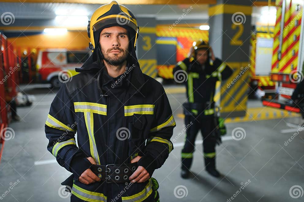 A Firefighter Puts on a Fire Uniform at the Fire Department Stock Photo ...