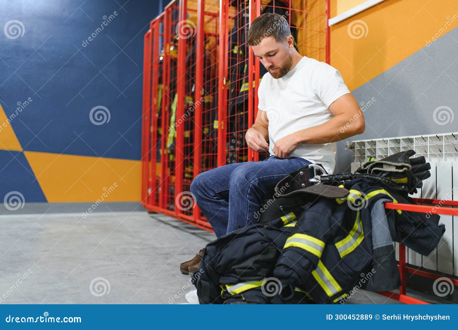A Firefighter Puts on a Fire Uniform at the Fire Department Stock Image ...