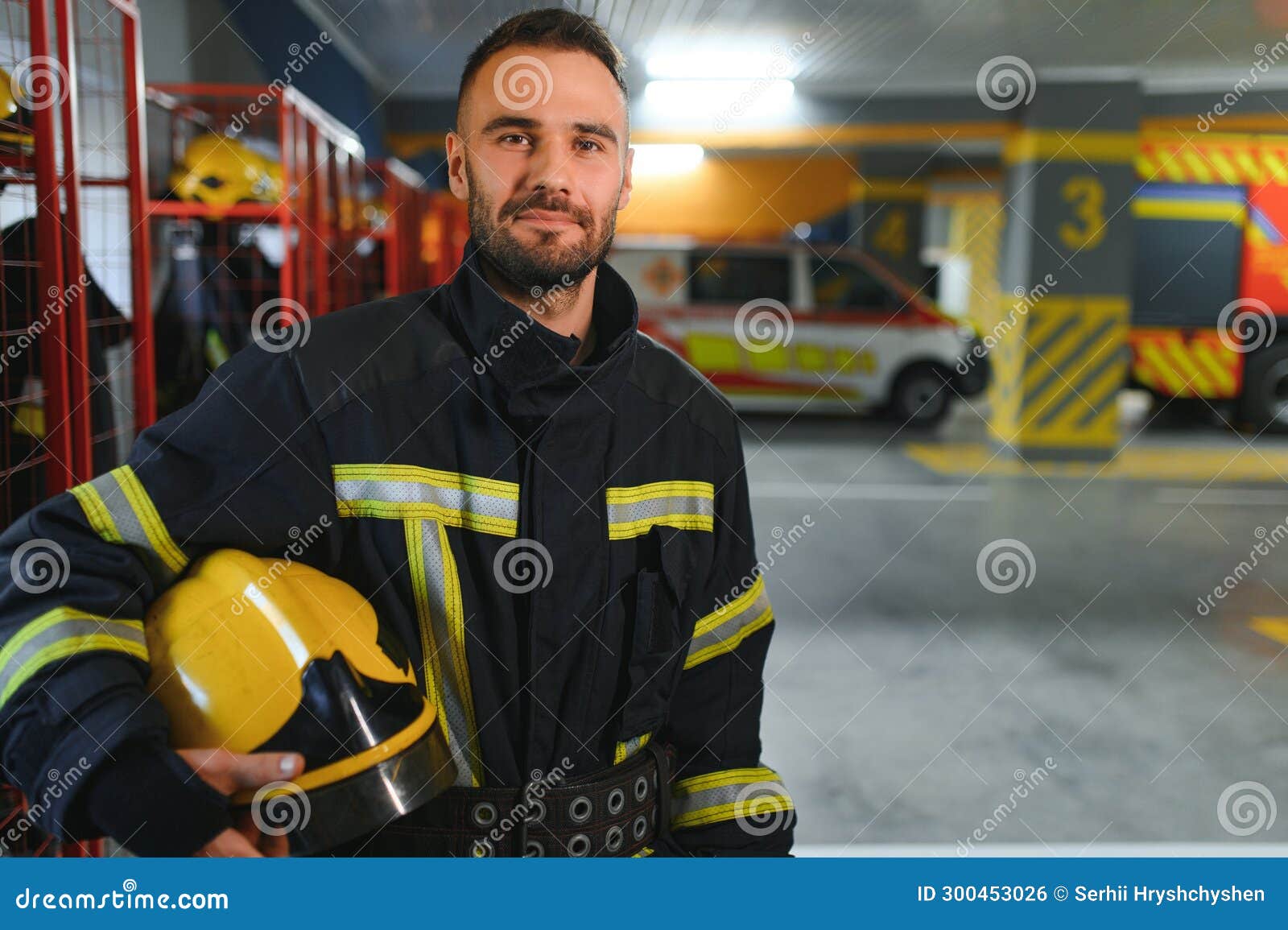 A Firefighter Puts on a Fire Uniform at the Fire Department Stock Photo ...