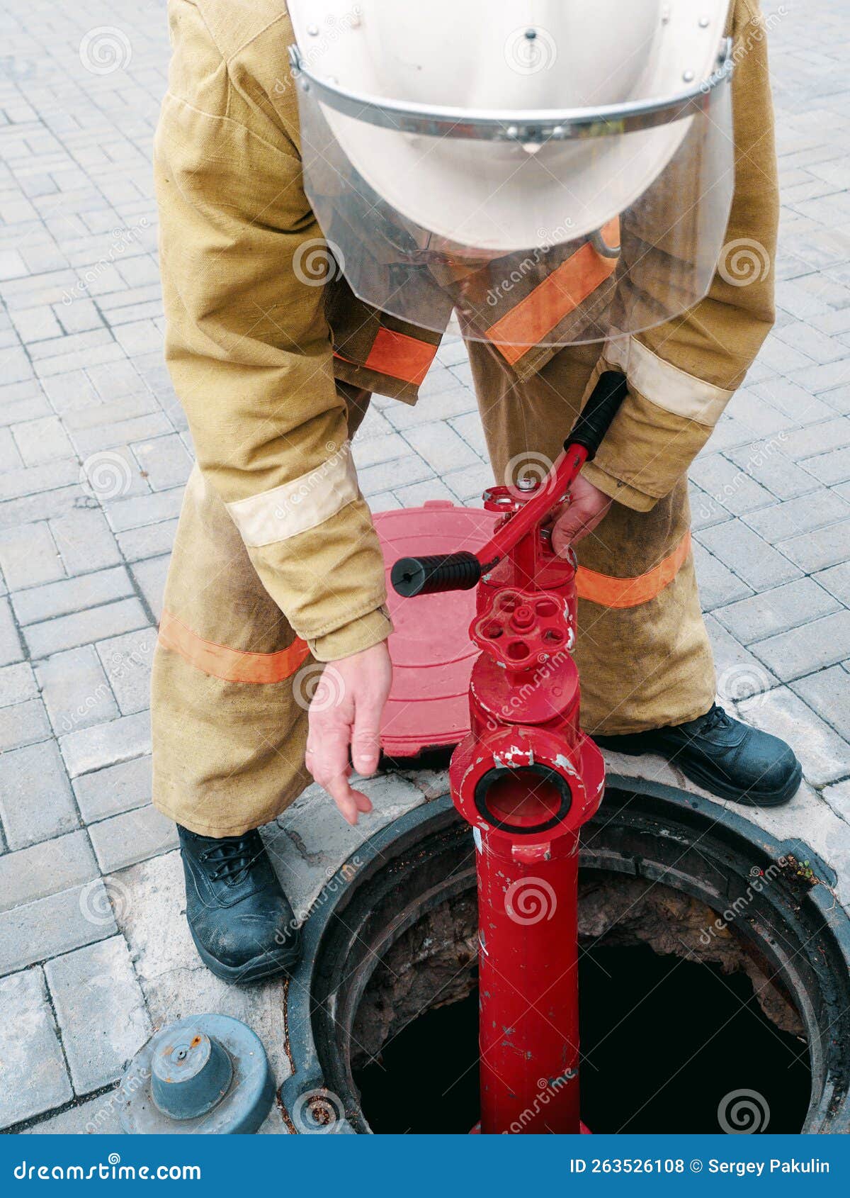 Firefighter or Rescuer Installs Fire Hydrant in Open Well. Fireman S ...