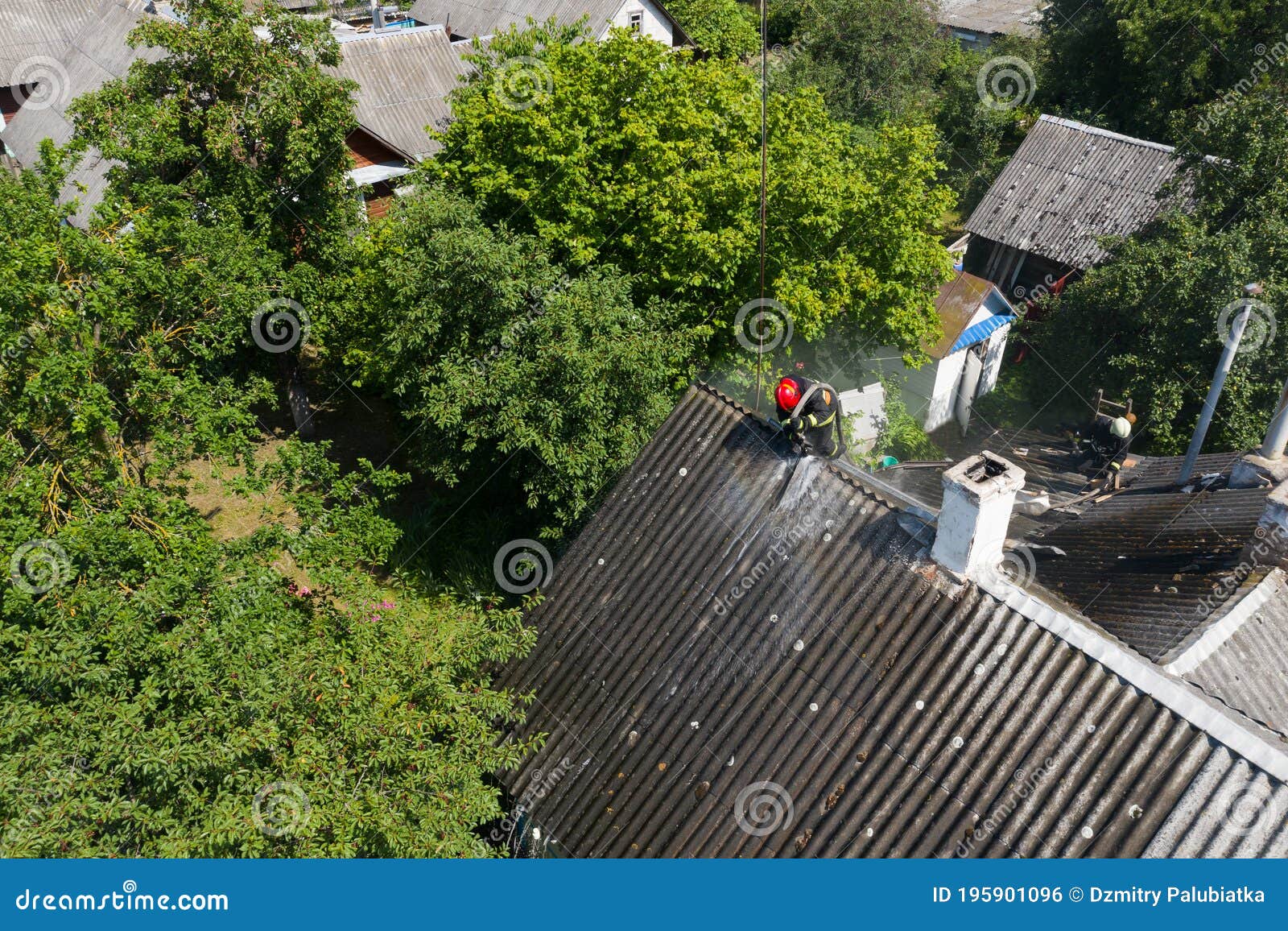 Firefighter on the Roof Extinguishes the Fire View from Above Stock ...