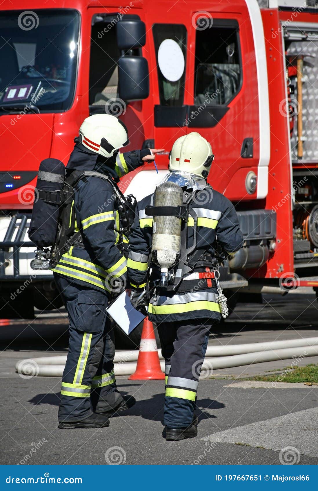 Firefighter at the Scene of a Fire Stock Image - Image of reel, tank ...