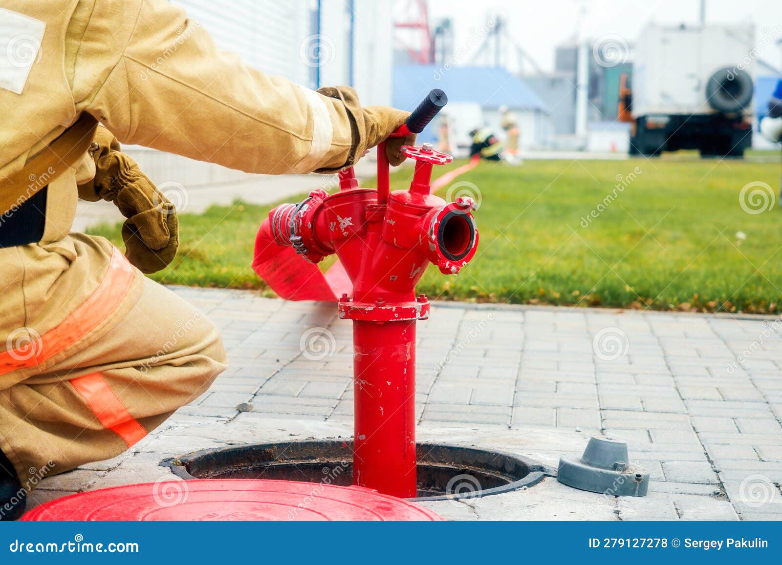 Firefighter Sits Next To Fire Hydrant. Back View Stock Photo - Image of ...