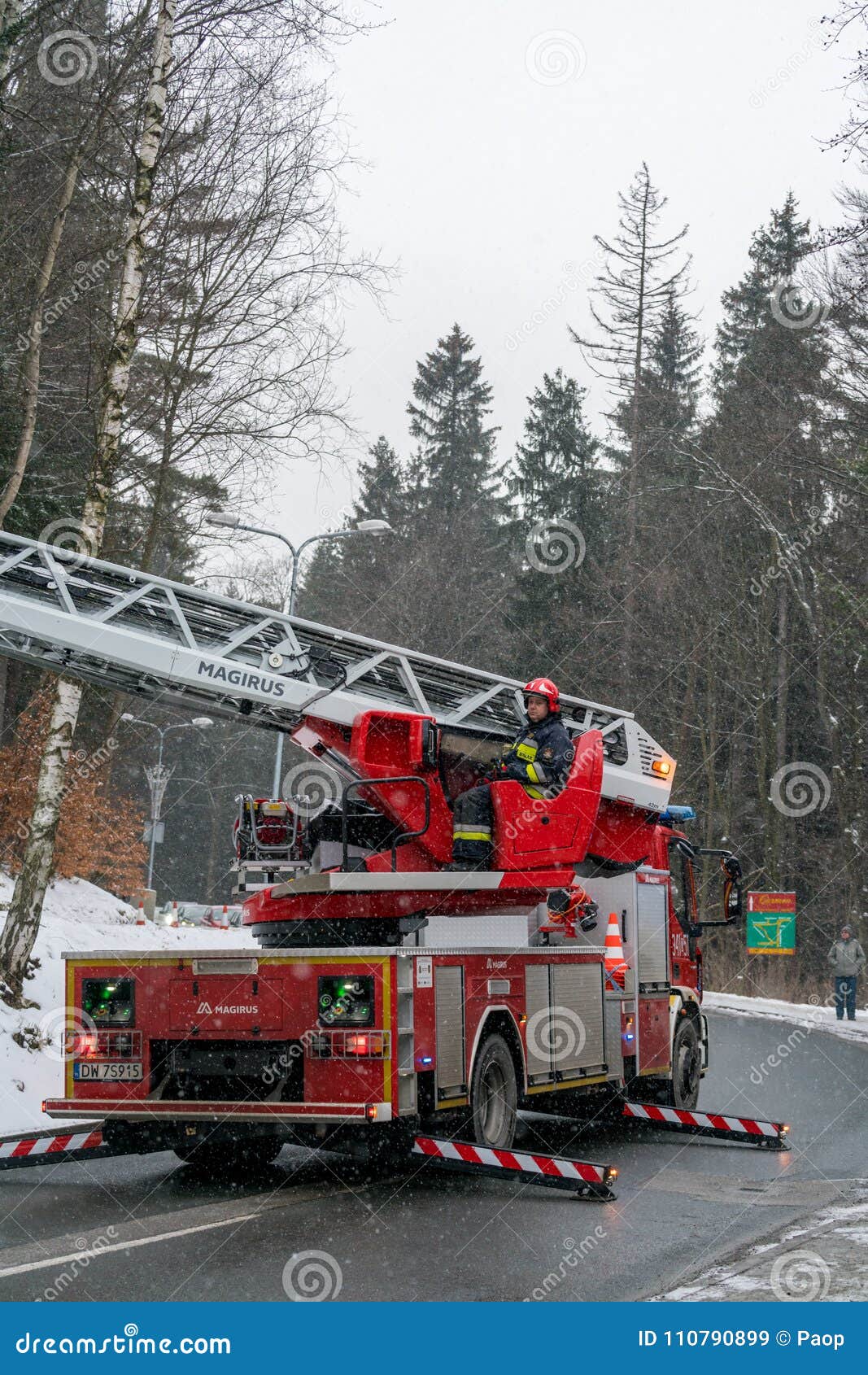 Firefighter Operating Ladder With Pylon Attached Next To Fire Training ...