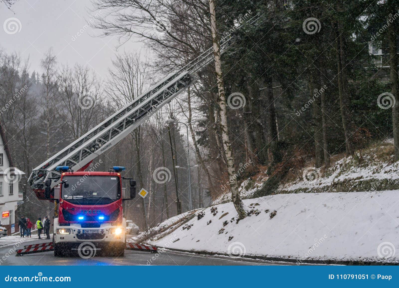 Firefighter Operating Ladder With Pylon Attached Next To Fire Training ...