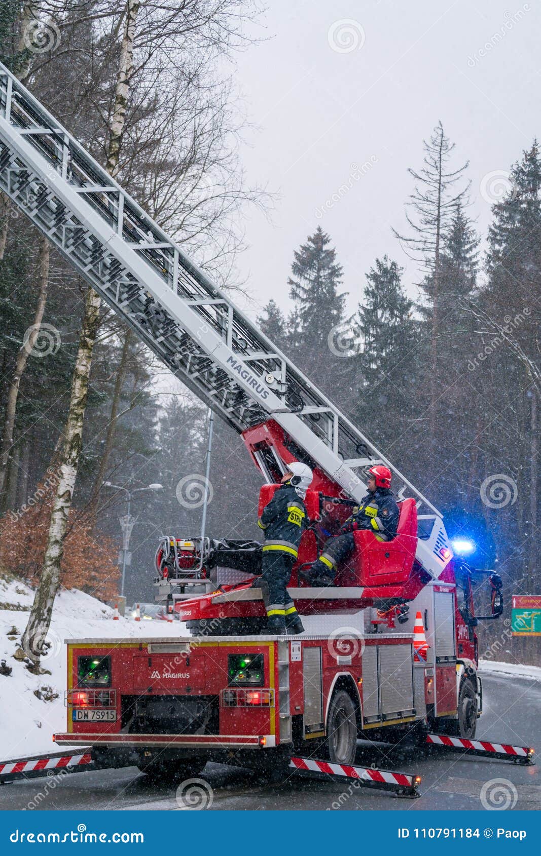 Firefighter Operating Ladder With Pylon Attached Next To Fire Training ...