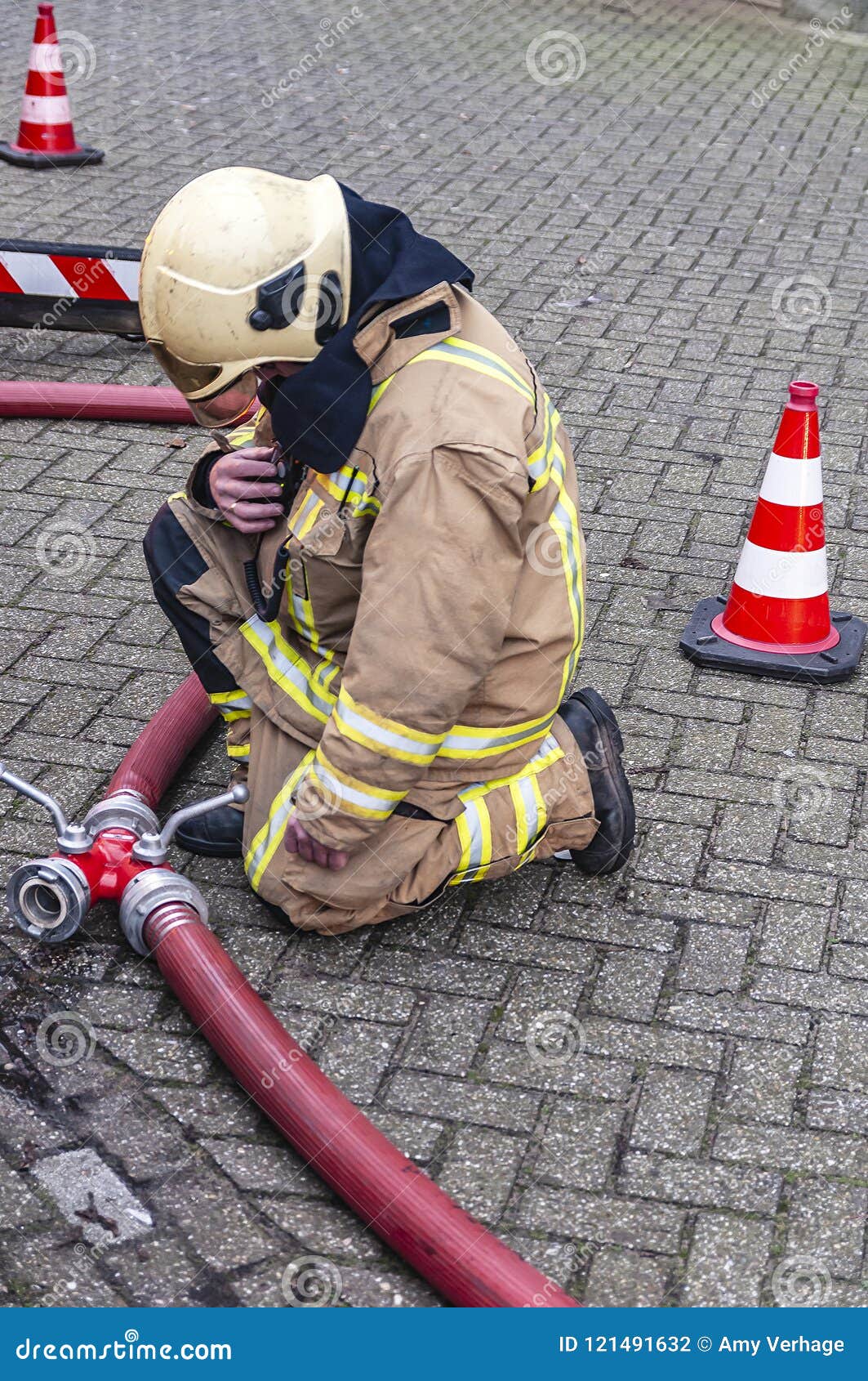 Fire-fighter is Sitting on the Street Stock Photo - Image of helmet ...