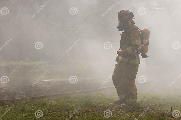Firefighter in Smoke stock image. Image of structure - 18059741