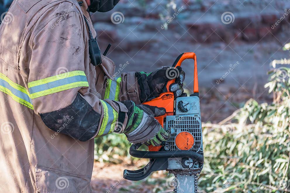 Firefighter Starting Chainsaw, in Rescue Stock Photo - Image of forest ...