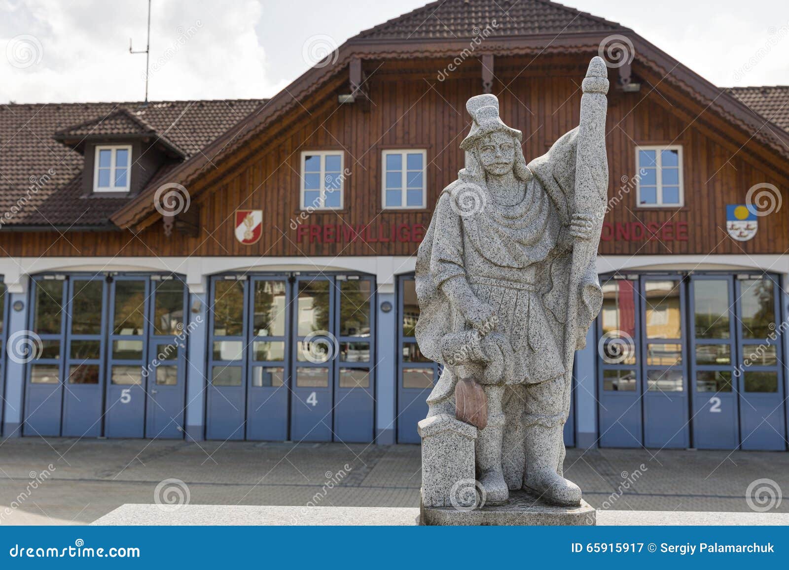 Firefighter Statue in Front of Fire Department. Mondsee, Austria. Stock ...
