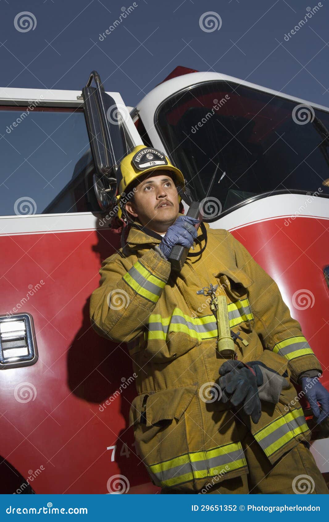 Firefighter Talking on Radio Stock Photo - Image of mature, glove: 29651352